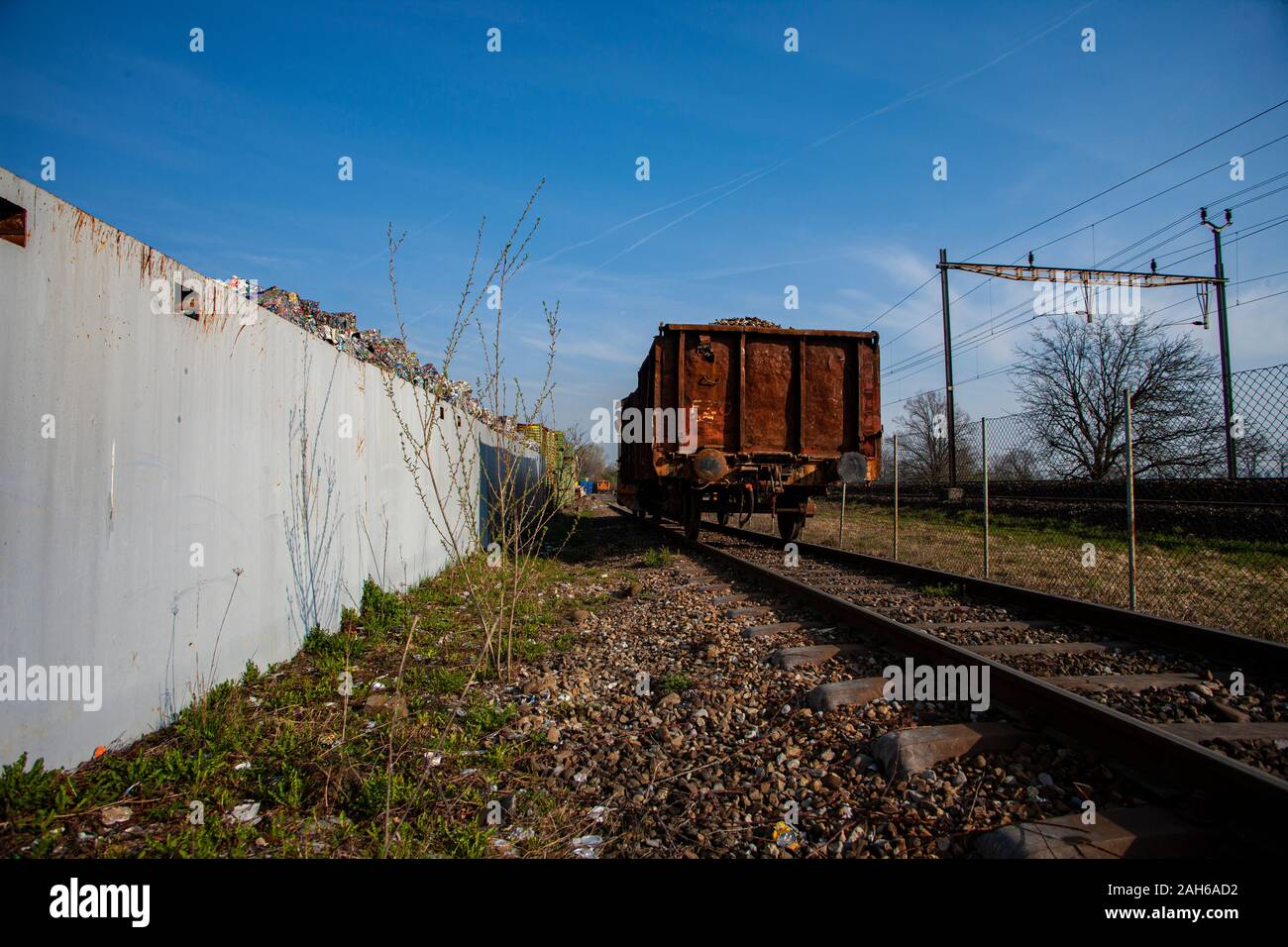 rusty railroad car waiting at recycle station Stock Photo - Alamy