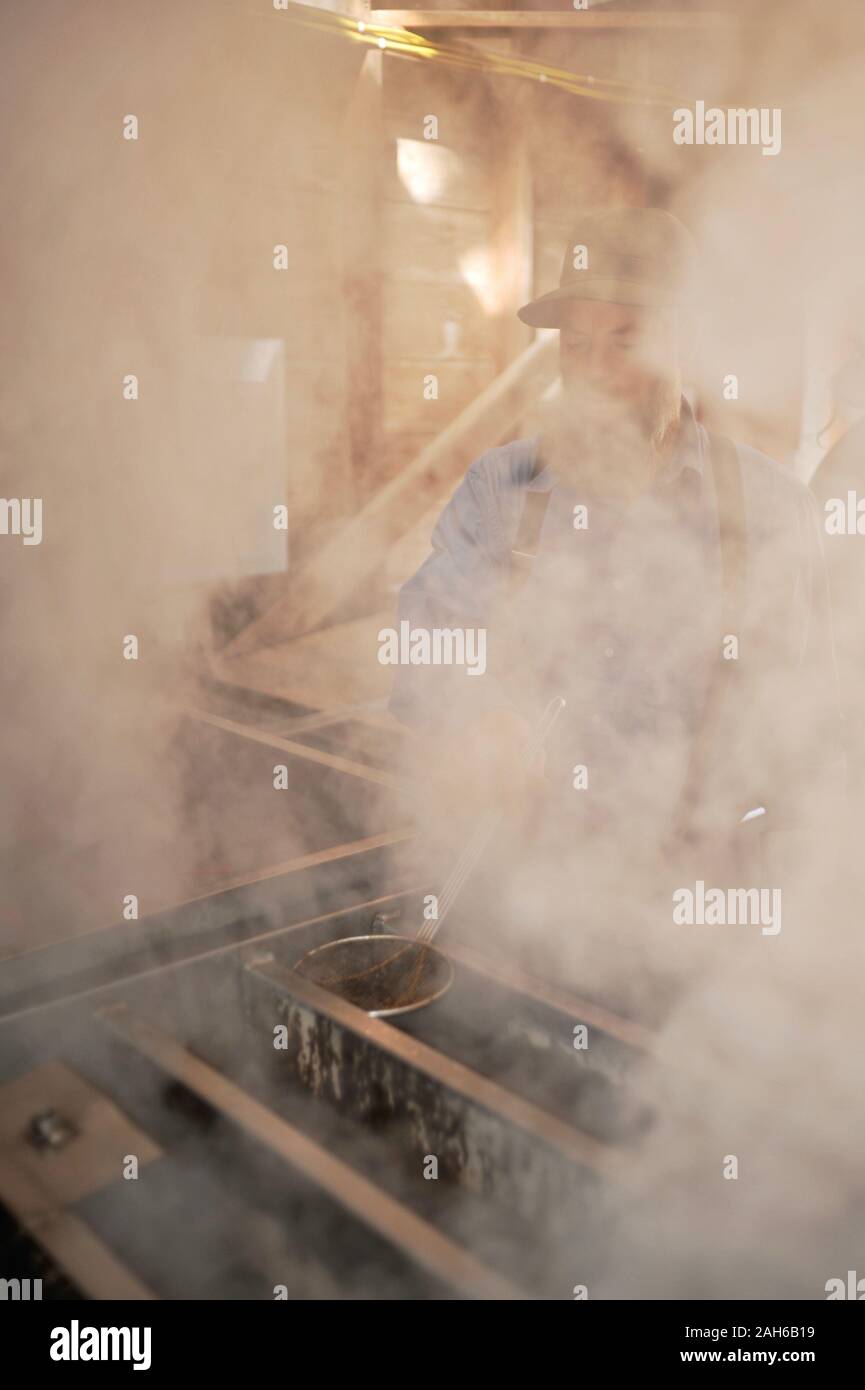 Making maple syrup by tapping maple trees, collecting sap, boiling sap ...