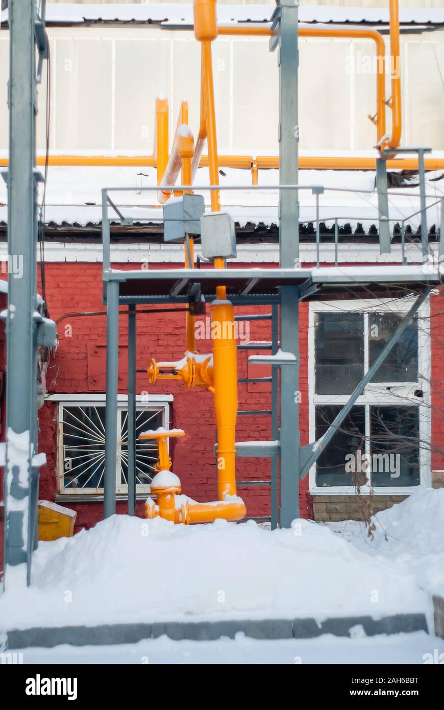 industrial background - fragment of a factory gas pipeline with valves ...