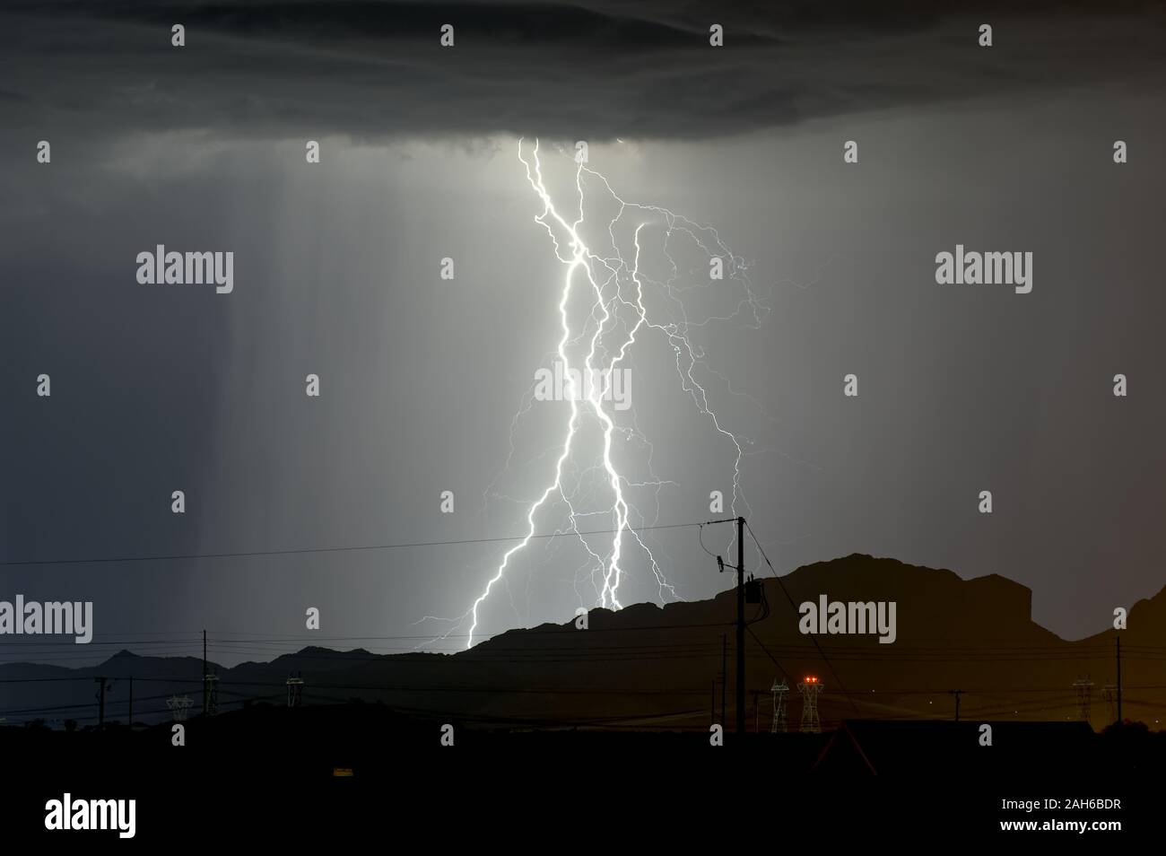 A late night Arizona Monsoon lightning storm striking near a mountain ...