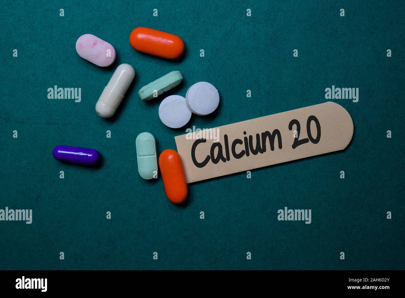 Calcium 20 write on stick note isolated on Office Desk. Medical concept ...