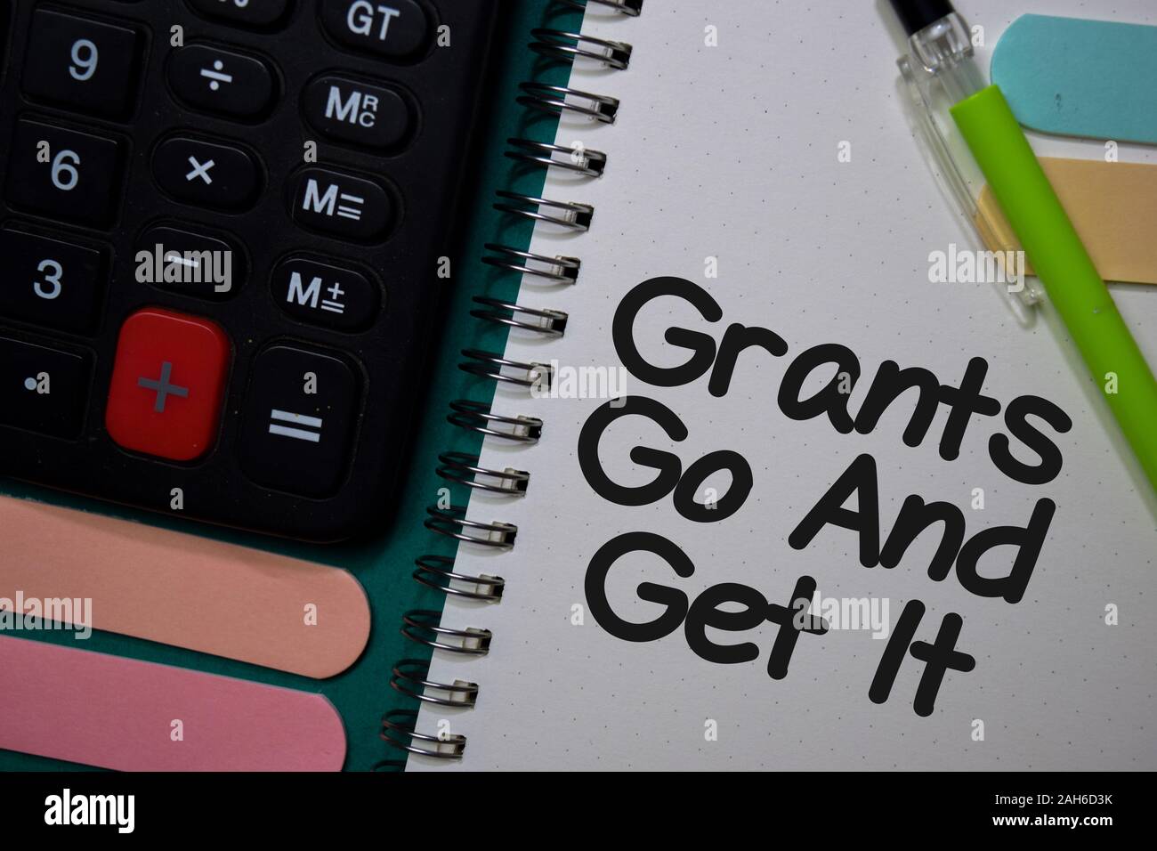 Grants Go and Get It write on a book isolated on Office Desk Stock ...