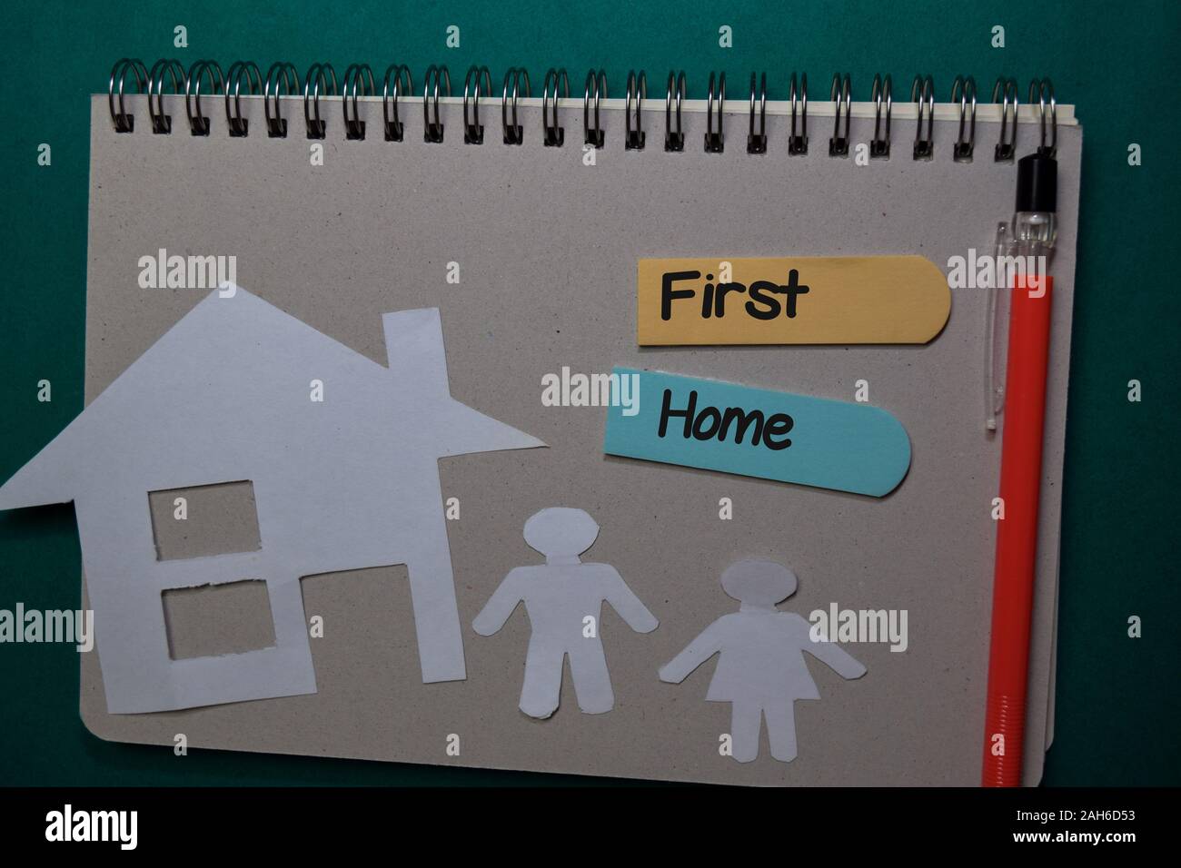 First Home write on stick note isolated on Office Desk Stock Photo - Alamy