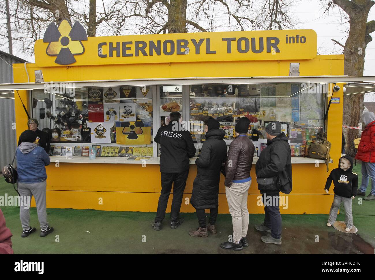 Kiev, Ukraine. 25th Dec, 2019. Visitors stand next to Chernobyl Tour ...