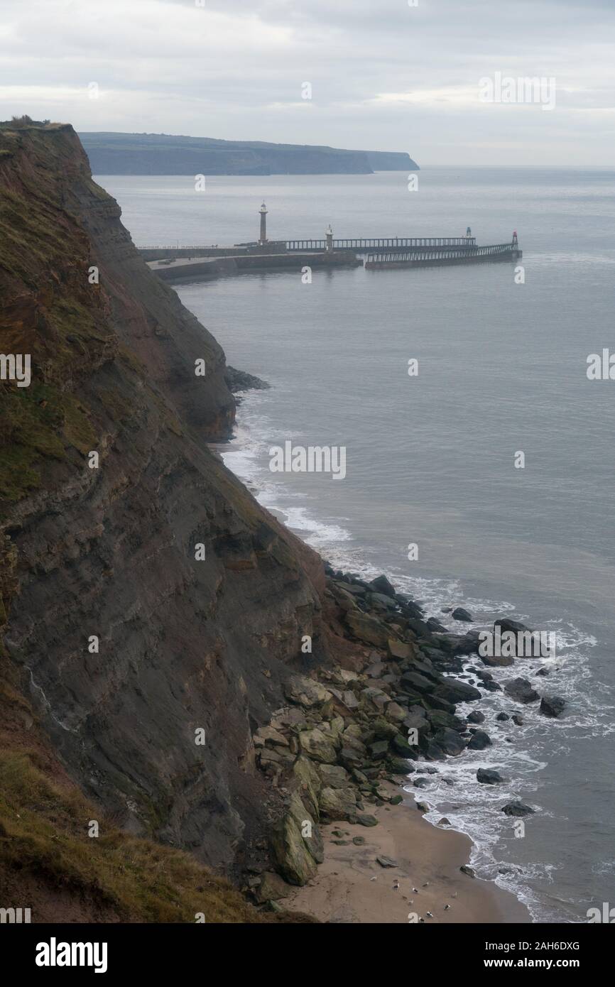 View of Whitby piers from Saltwick Bay Stock Photo - Alamy