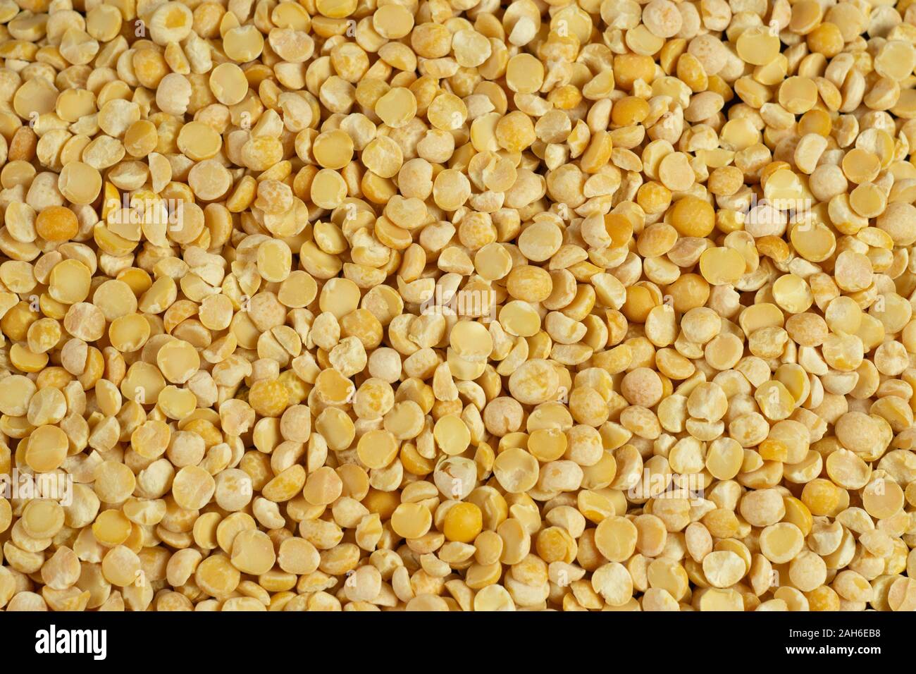 Split yellow dried peas texture Stock Photo - Alamy