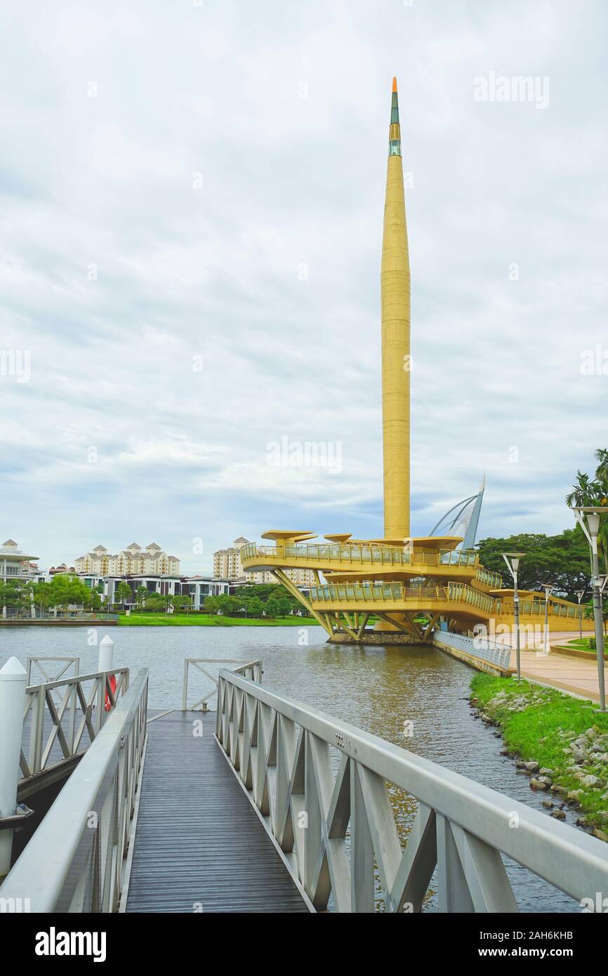 Gold color monument named Millennium Monument in Putrajaya, Malaysia ...