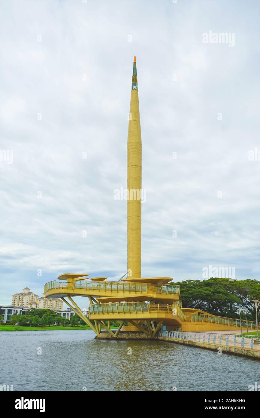 Gold color monument named Millennium Monument in Putrajaya, Malaysia ...