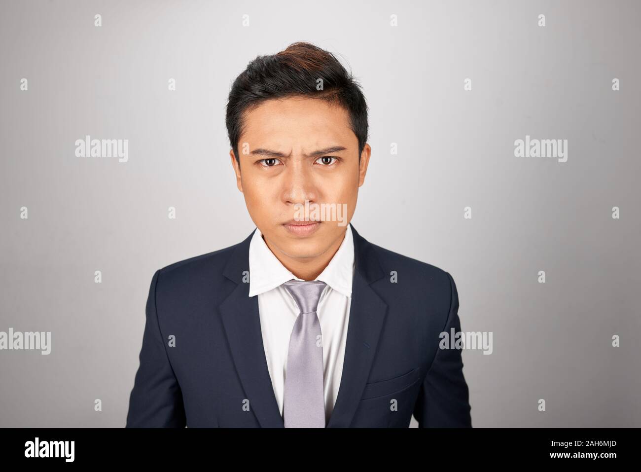Portrait of dissatisfied sad handsome businessman Stock Photo - Alamy
