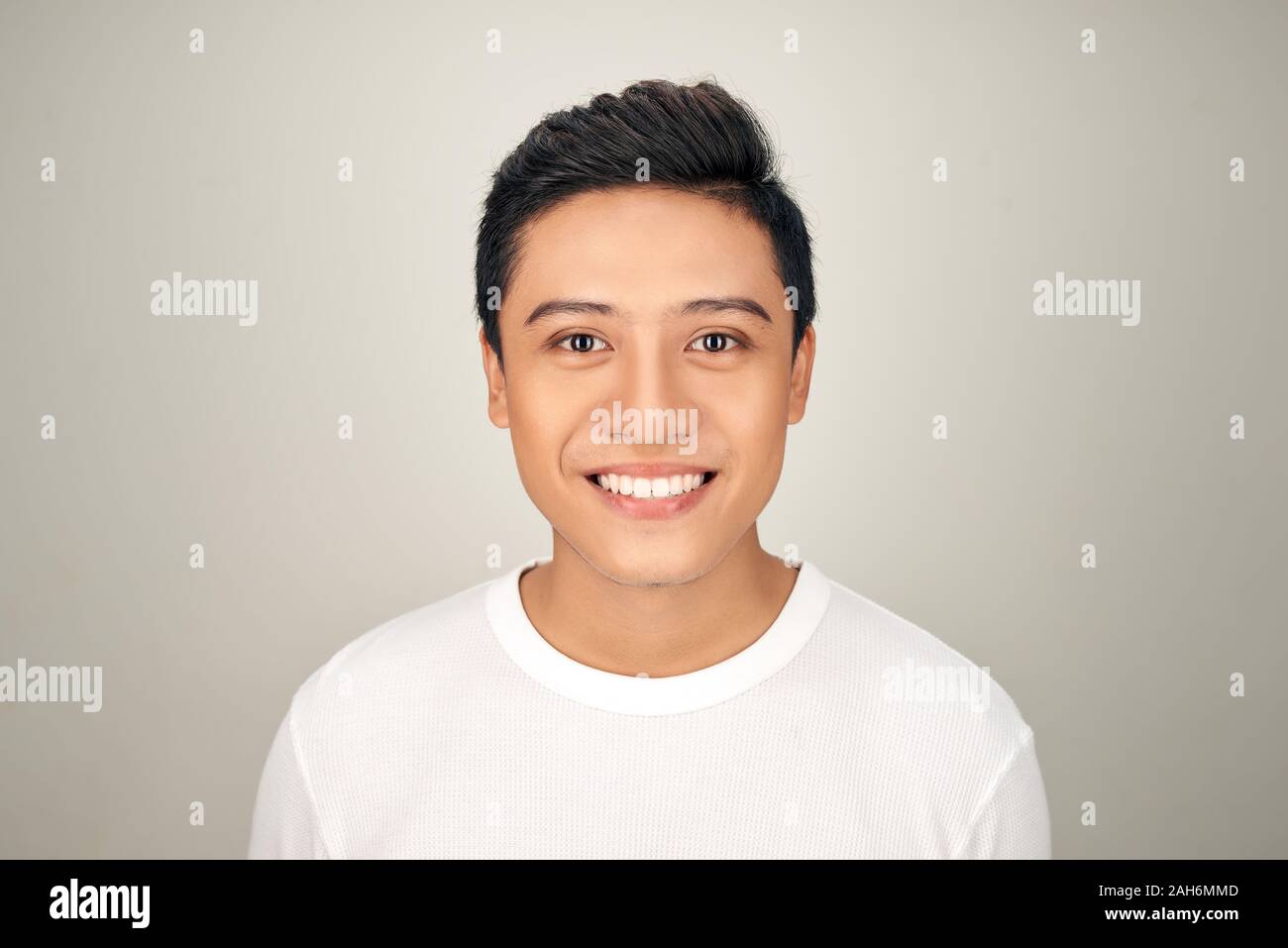 Portrait of happy handsome young Asian man is smiling on white ...