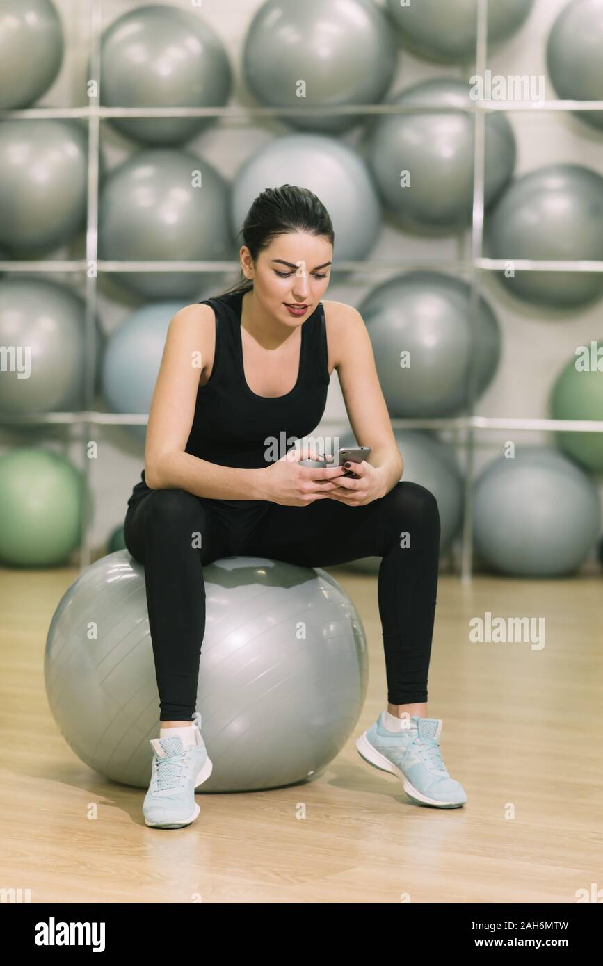 Woman involved in sports with a ball and rest Stock Photo - Alamy