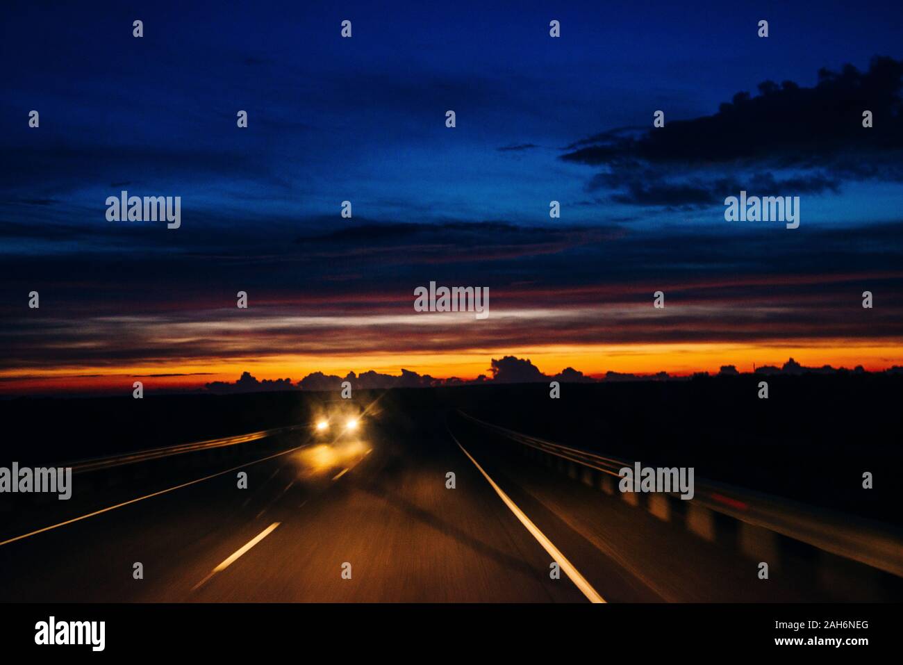 Silhouette of car on bridge in sunset at night Stock Photo - Alamy