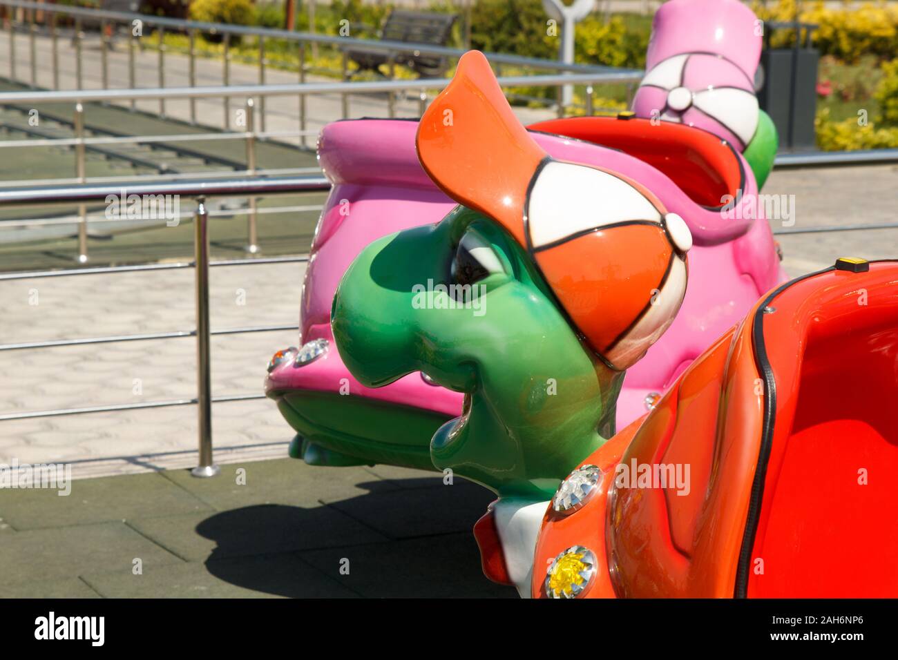 Children's amusement park with swings and green turtle Stock Photo - Alamy