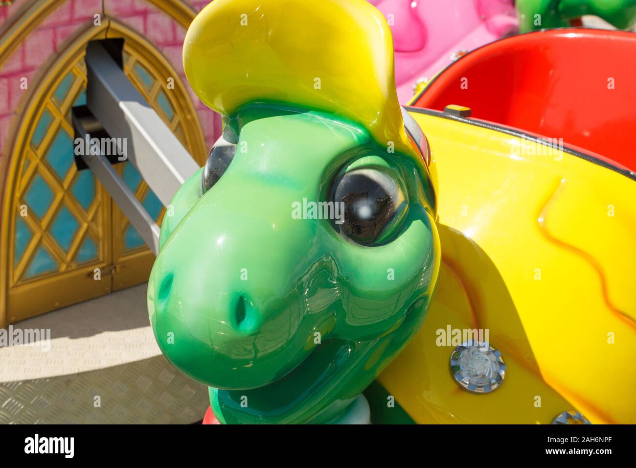 Children's amusement park with swings and green turtle Stock Photo - Alamy