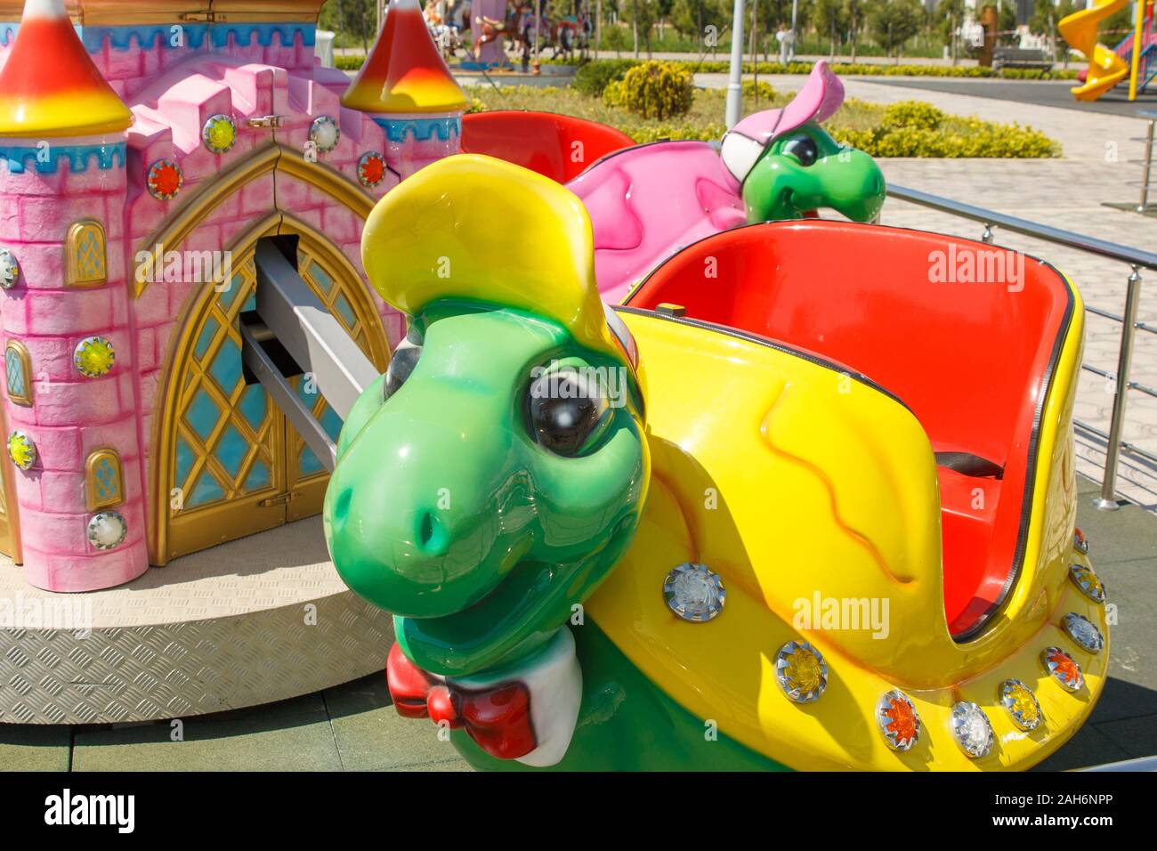 Children's amusement park with swings and green turtle Stock Photo - Alamy