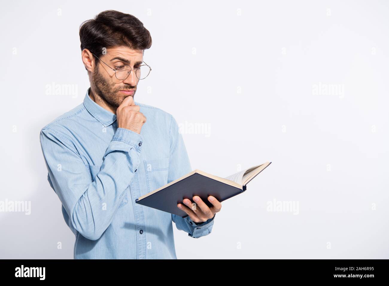 Photo of multiethnic intelligent guy making math decisions looking ...