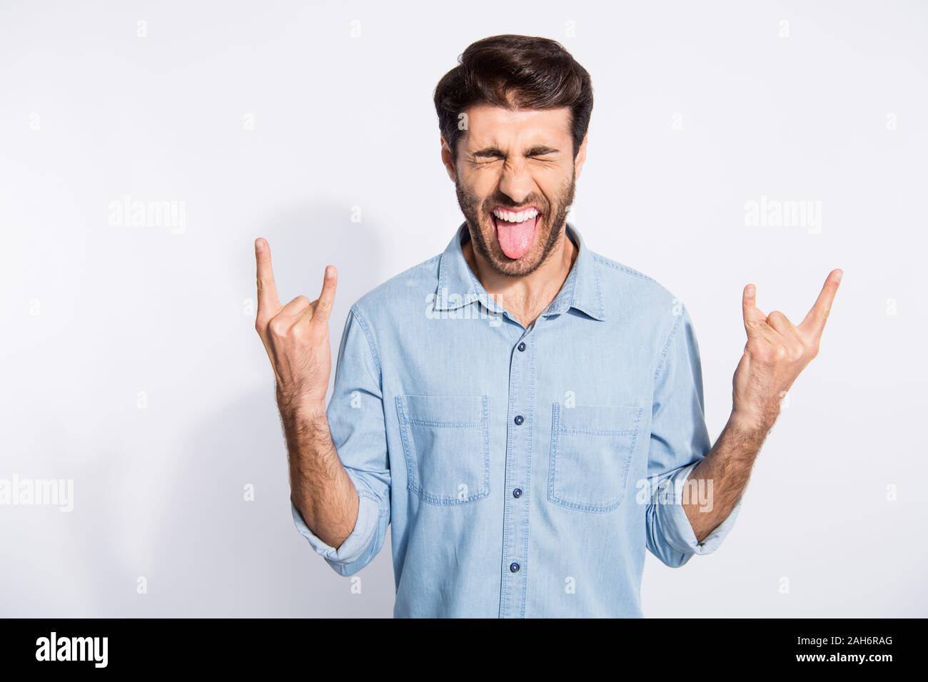 Photo of multiethnic funky guy sticking tongue out of mouth making ...