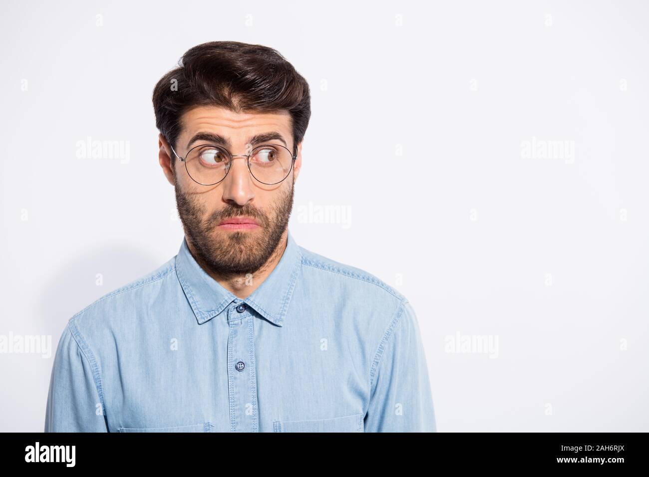 Photo of amazing indian guy looking side empty space feel guilty for ...