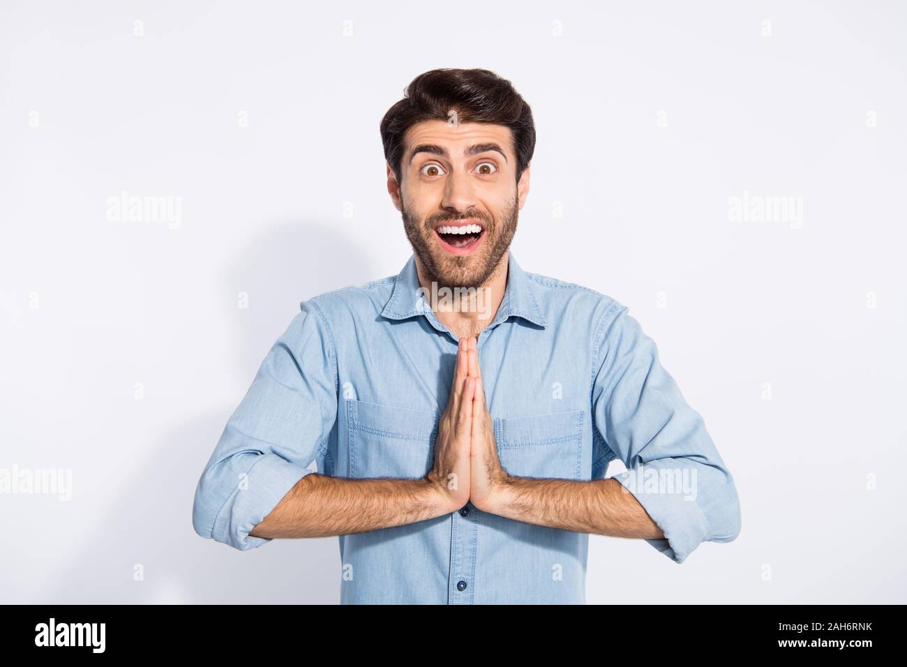 Photo of amazing handsome guy holding arms together asking football ...