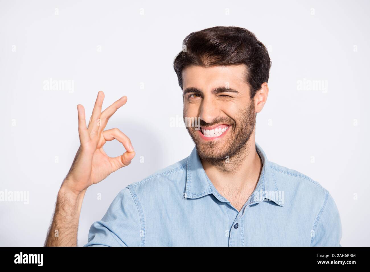 Photo of nice multiethnic handsome guy showing okey symbol approving ...