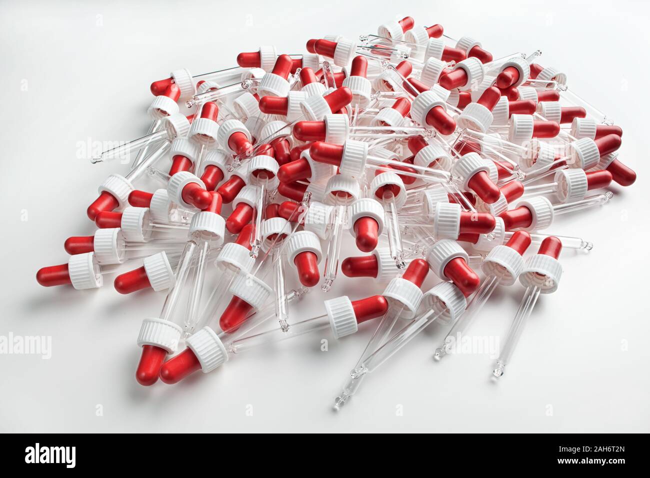 Transparent pipettes with a red bellow on a white background Stock ...