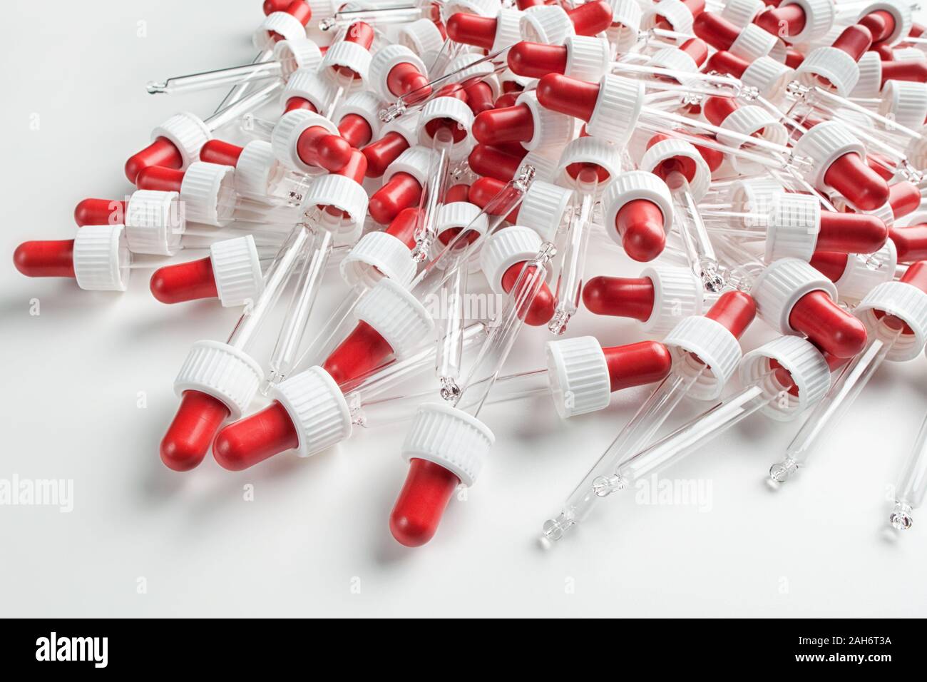 Transparent pipettes with a red bellow on a white background Stock ...