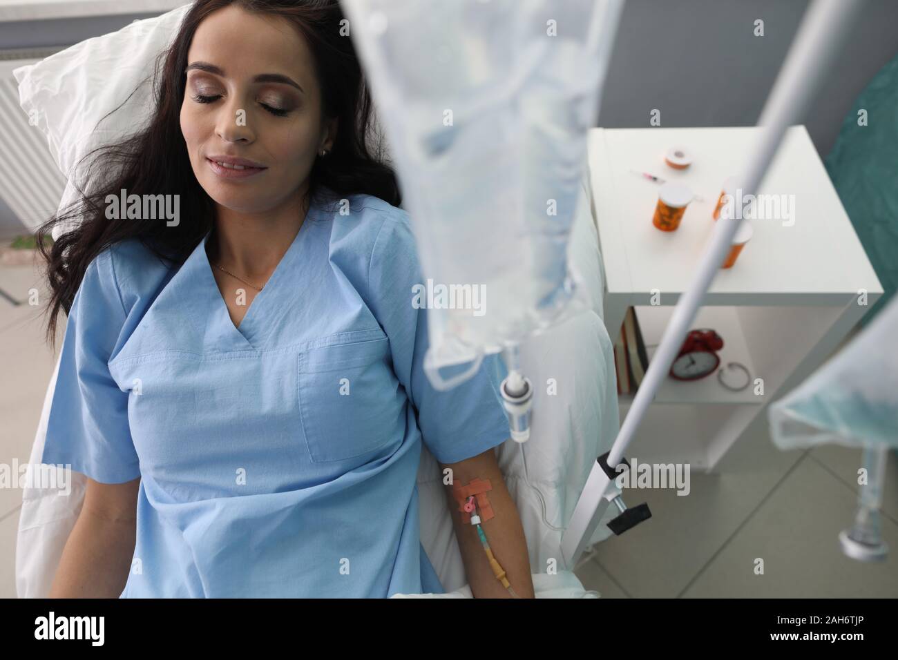 Sick patient taking medication Stock Photo - Alamy
