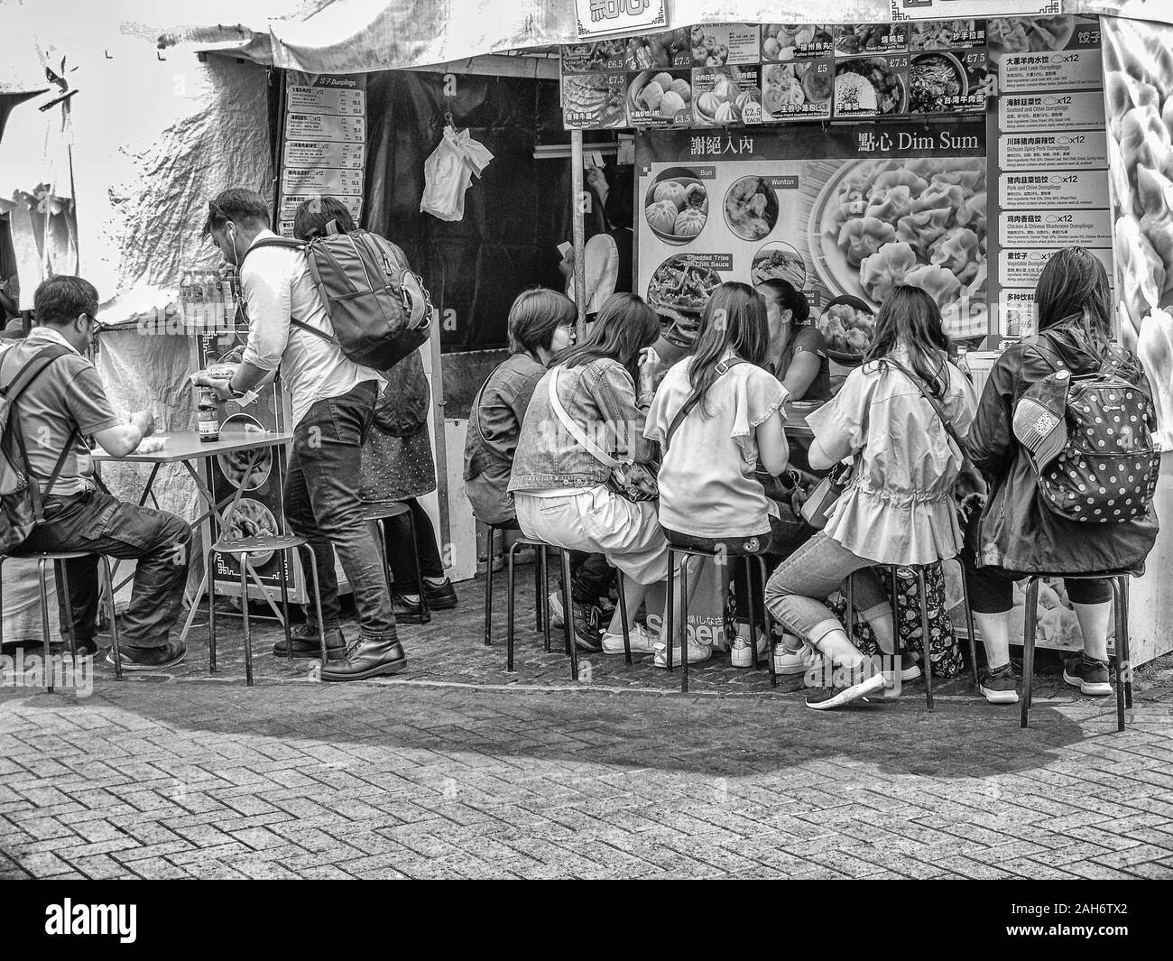Street food eating Black and White Stock Photos & Images - Alamy