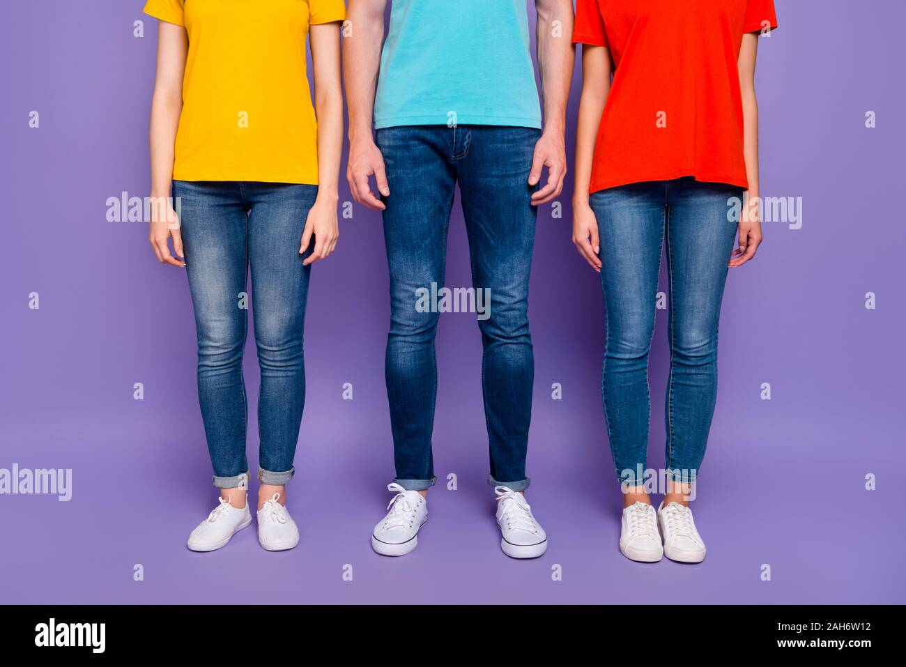 Close up photo of three people standing, straight wearing street style ...