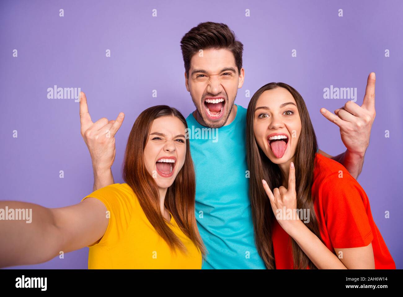 Close-up photo portrait of mad wild clubbers rock concert goers showing ...