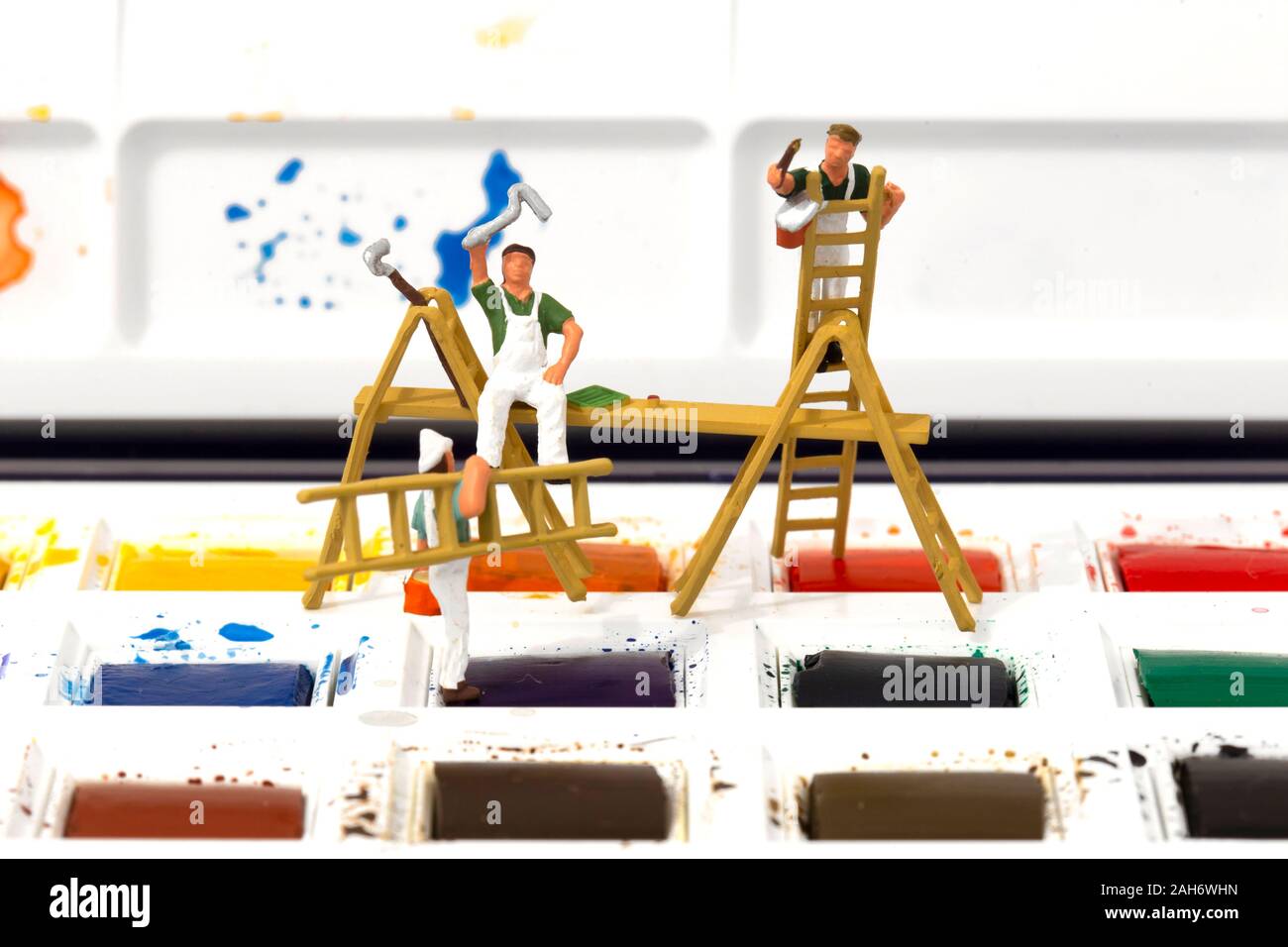 Miniature scale model painters decorators on a watercolour palette set ...