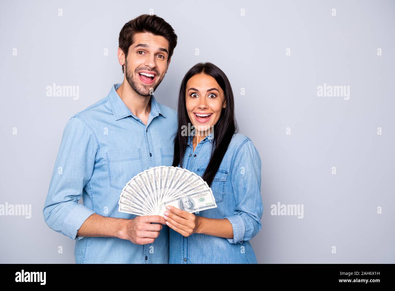 Photo of two hugging people together holding money they have won at ...