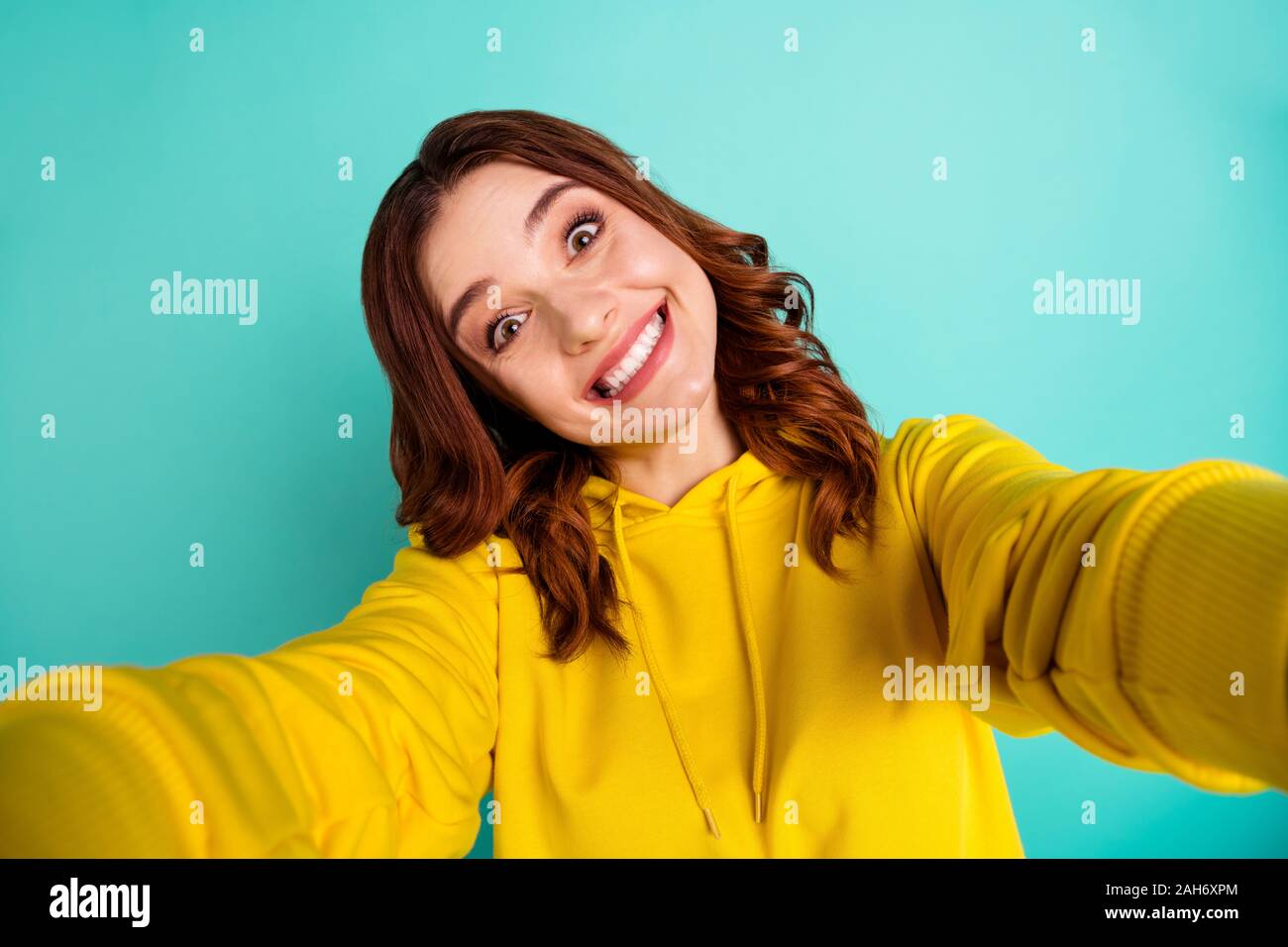 Photo of trendy cute cheerful nice millennial smiling toothily showing ...