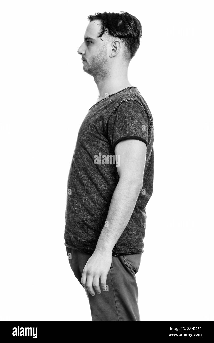 Profile view of young man standing in black and white Stock Photo - Alamy