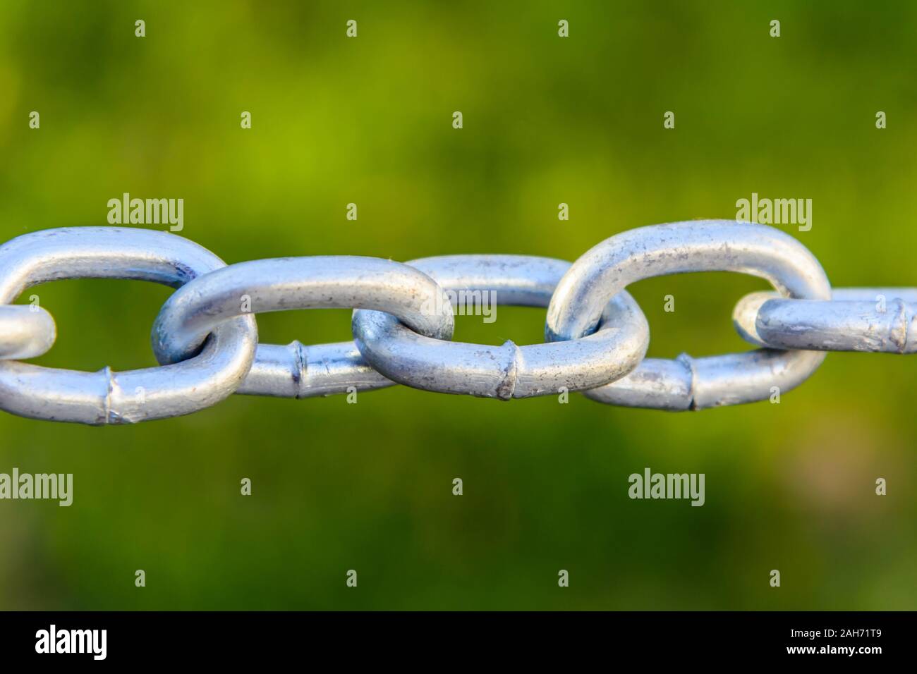 metal chain silver color closeup on the streets Stock Photo - Alamy