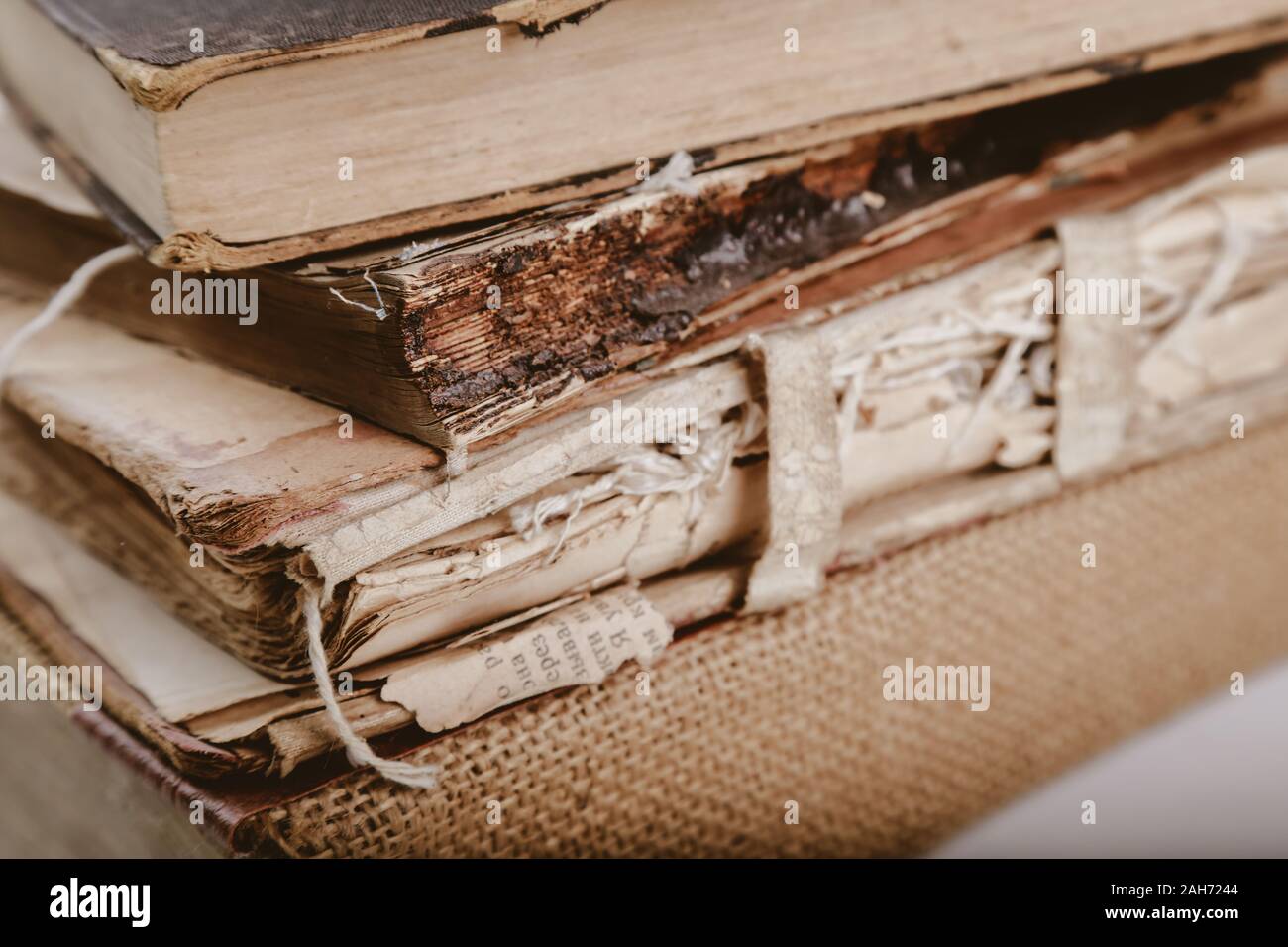a ragged old rare book with many pages Stock Photo - Alamy