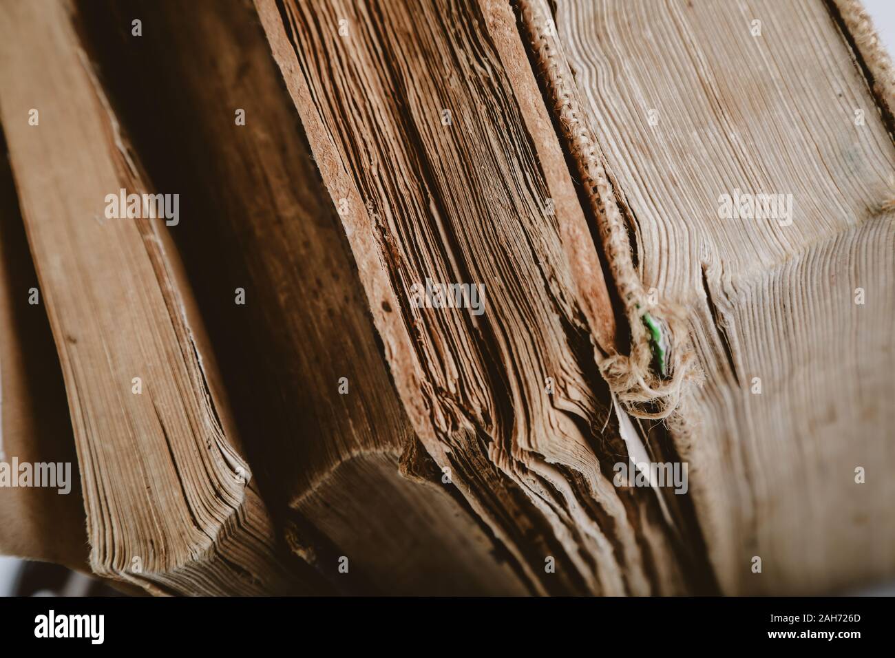 a ragged old rare book with many pages Stock Photo - Alamy