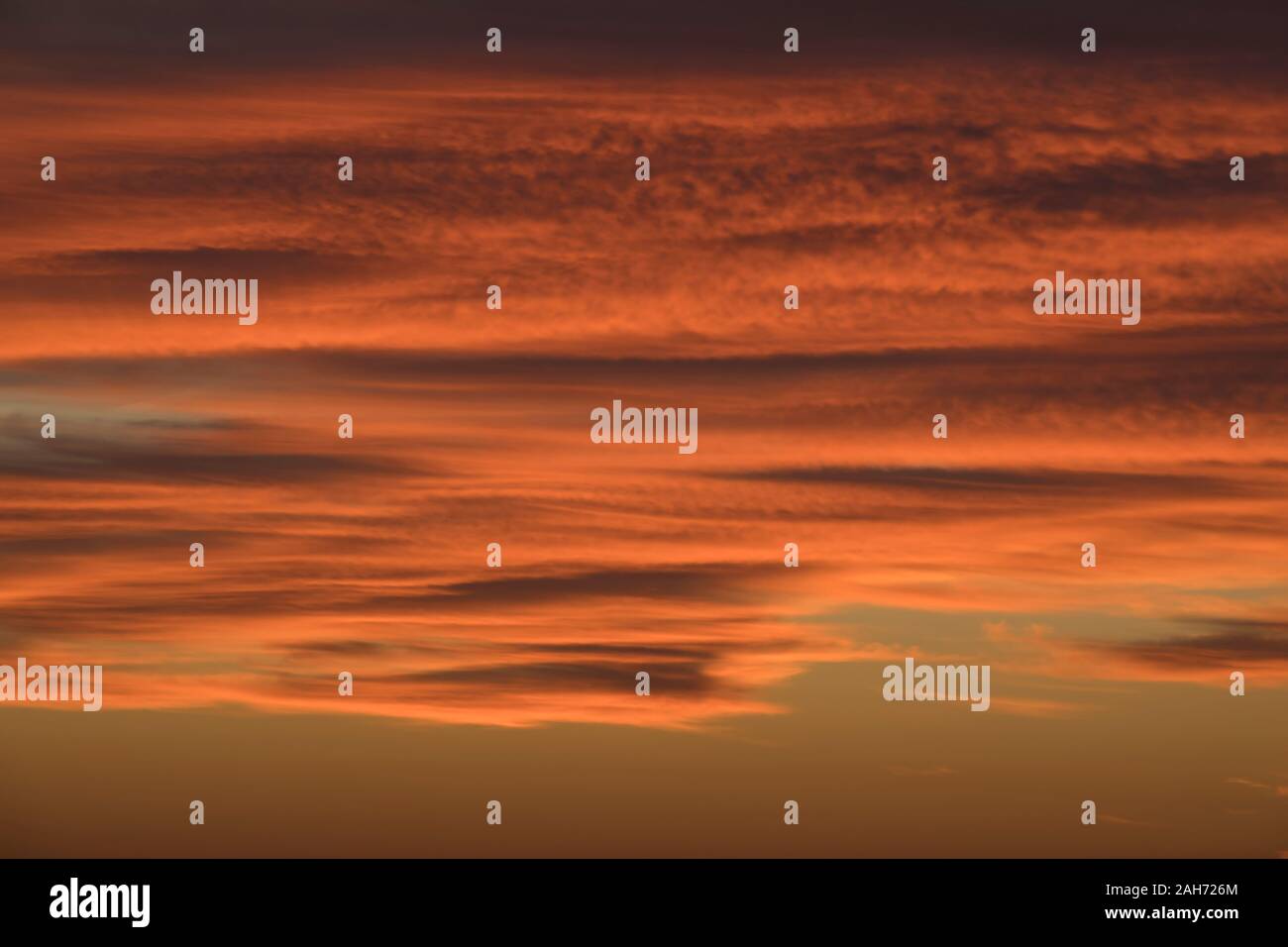 Texture of orange clouds at sunrise Stock Photo - Alamy