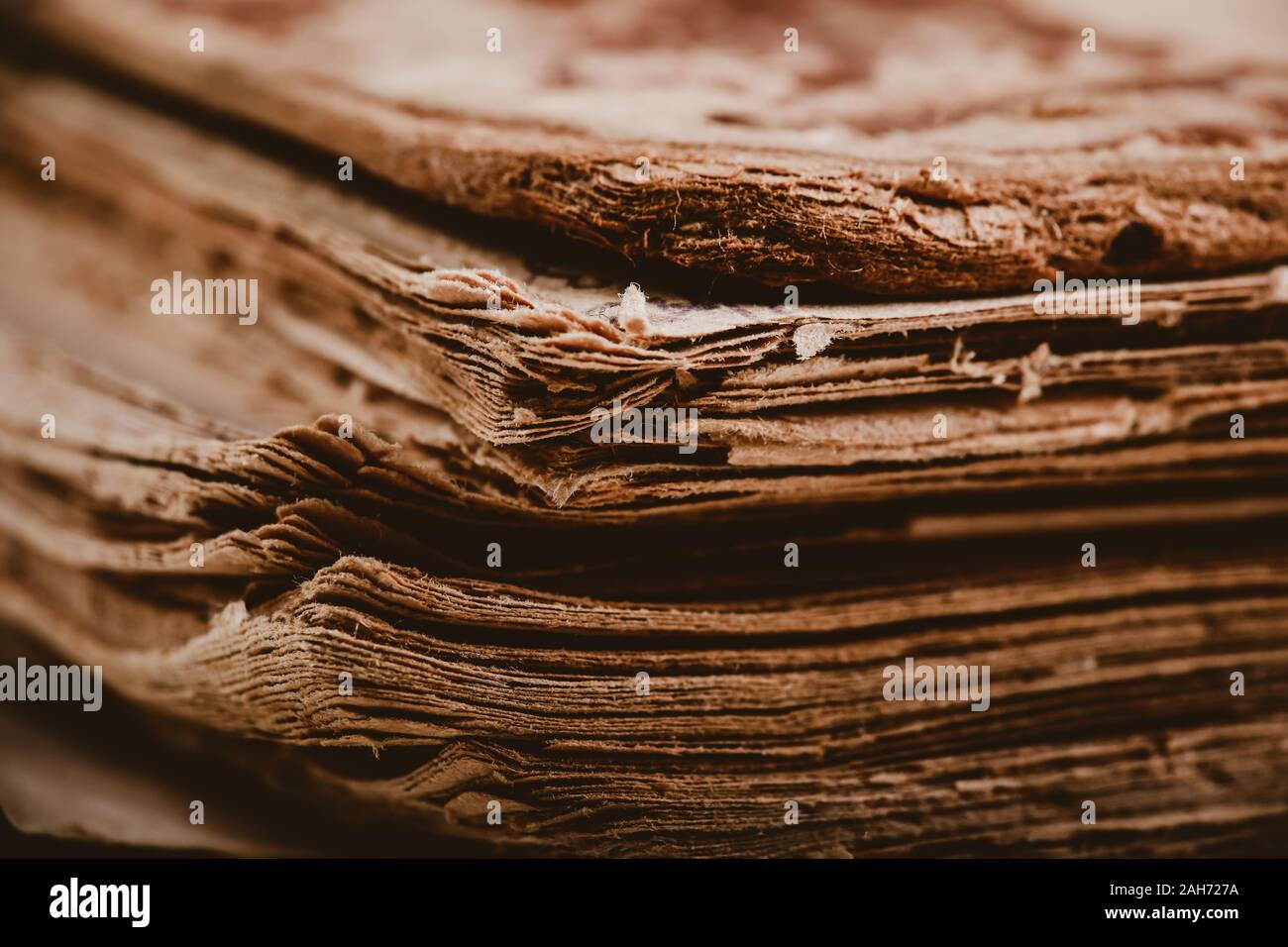 a ragged old rare book with many pages Stock Photo - Alamy