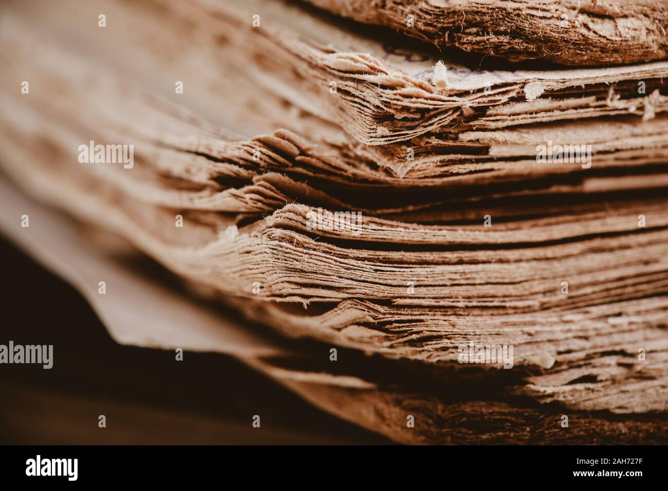 a ragged old rare book with many pages Stock Photo - Alamy