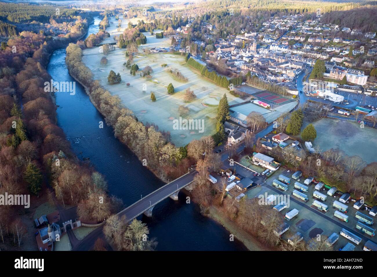Aerial view of golf course green from above frozen grass in winter at ...