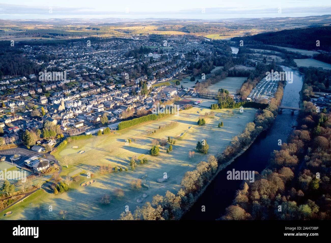 Aerial view of golf course green from above frozen grass in winter at ...