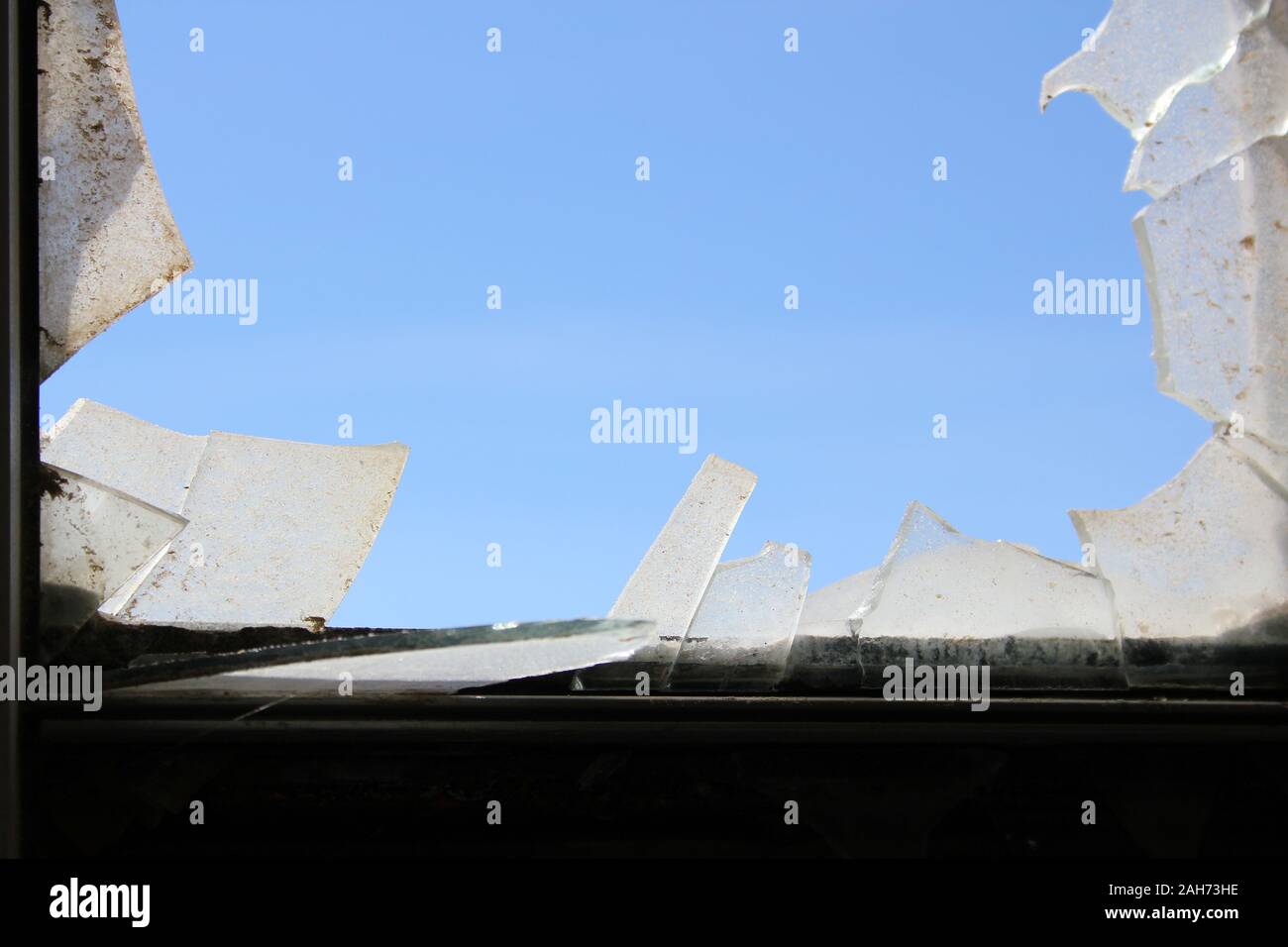Emergency exit through a broken window Stock Photo - Alamy