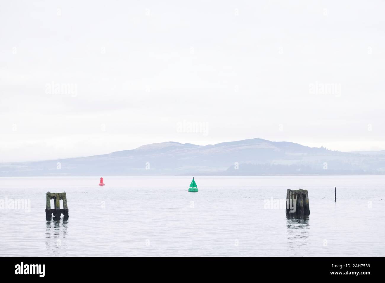 Wooden sea posts for sea ship safety at port dock Stock Photo - Alamy