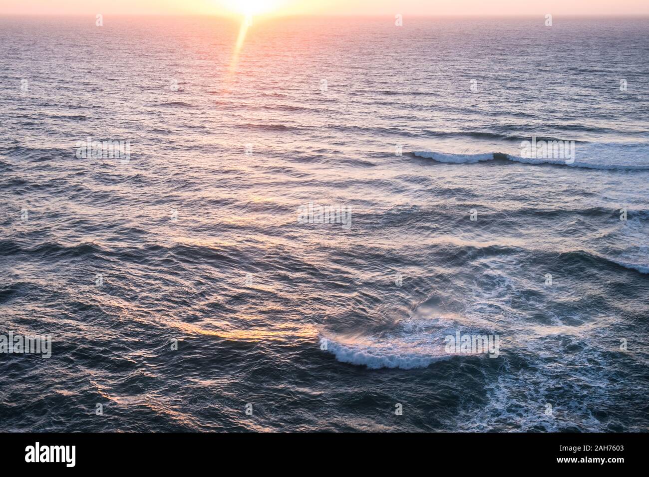 Aerial view over the ocean of sun rising over water waves surface Stock ...