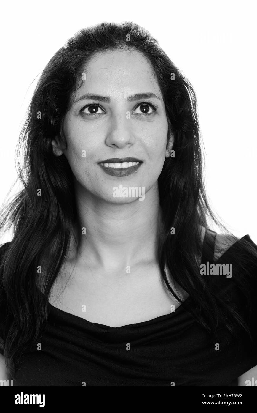 Face of happy Persian woman smiling while thinking Stock Photo - Alamy