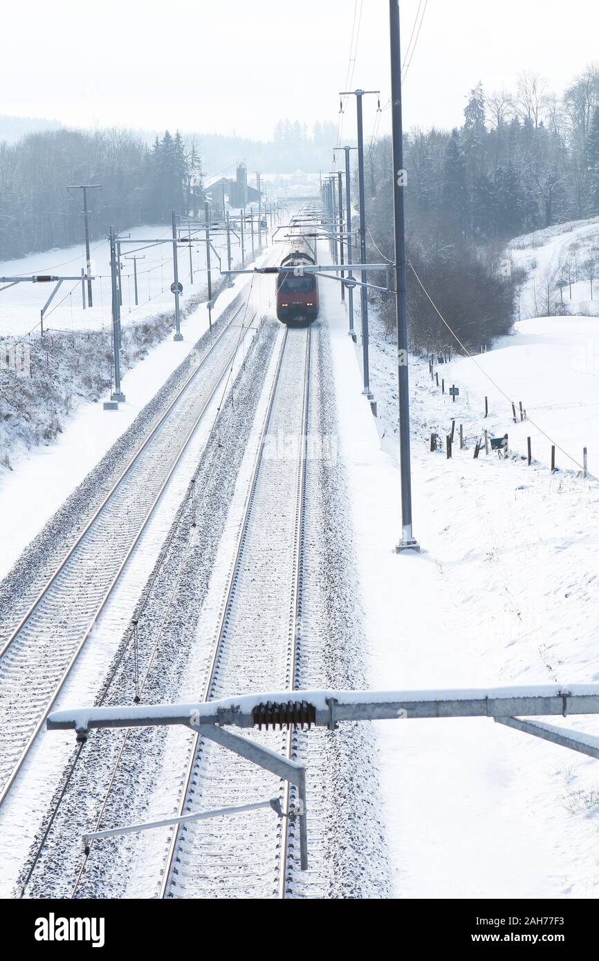 rail road tracks during Swiss winter Stock Photo - Alamy