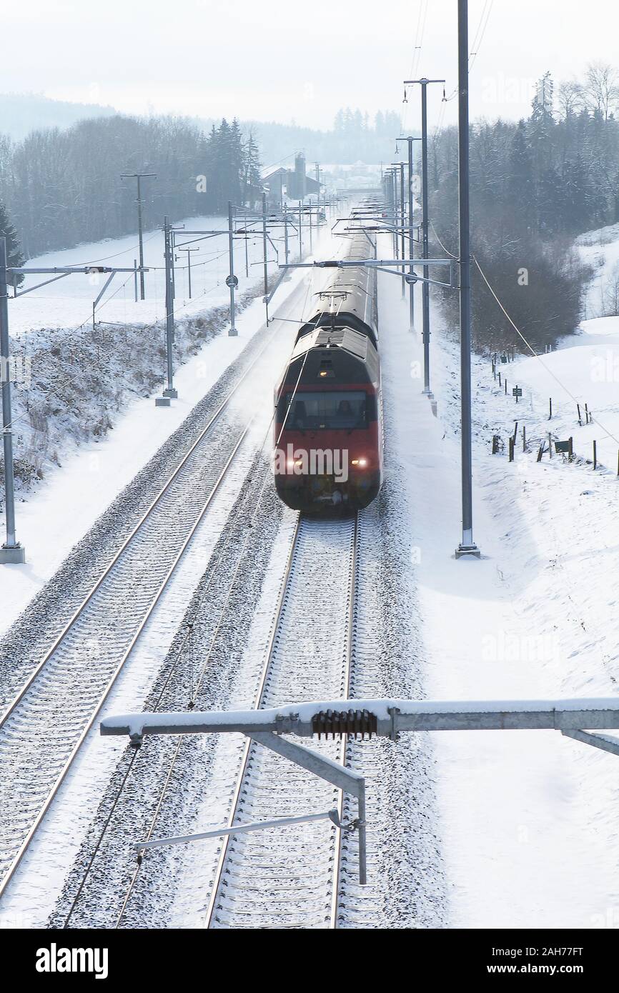 rail road tracks during Swiss winter Stock Photo - Alamy