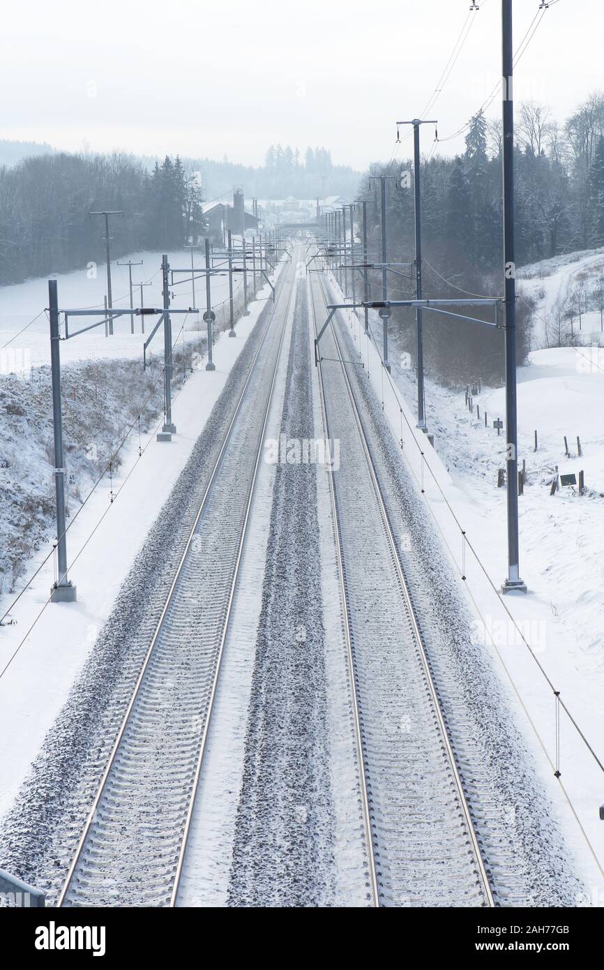 rail road tracks during Swiss winter Stock Photo - Alamy