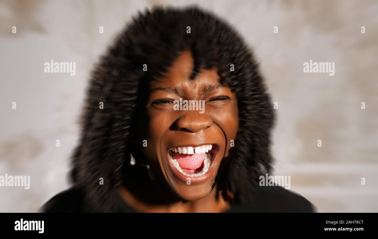eal Afro American lady with fleecy hair screams in anger and cries ...